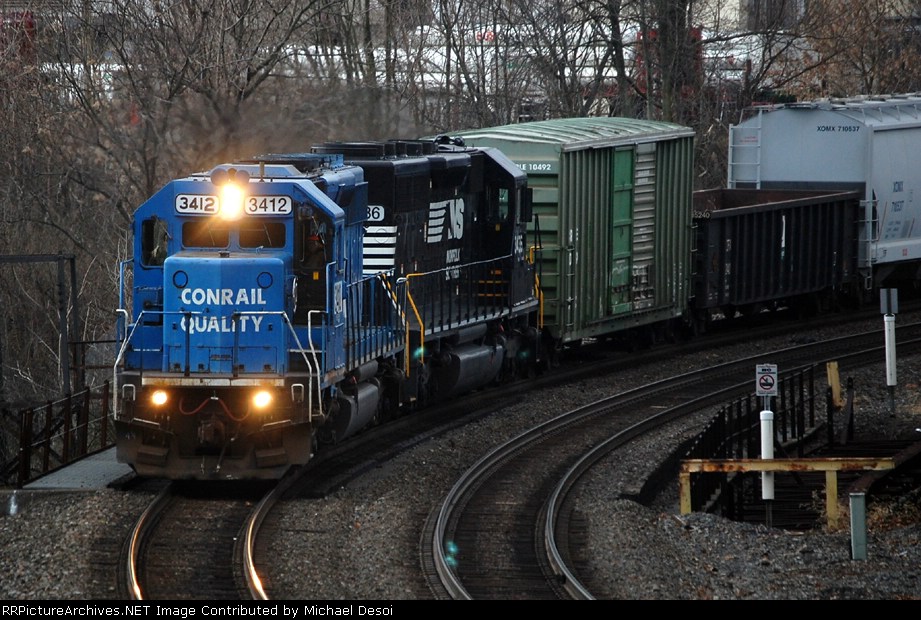 NS SD-40-2 #3412 still in Conrail Quality Colors leads an eastbound around the curve at Steel City